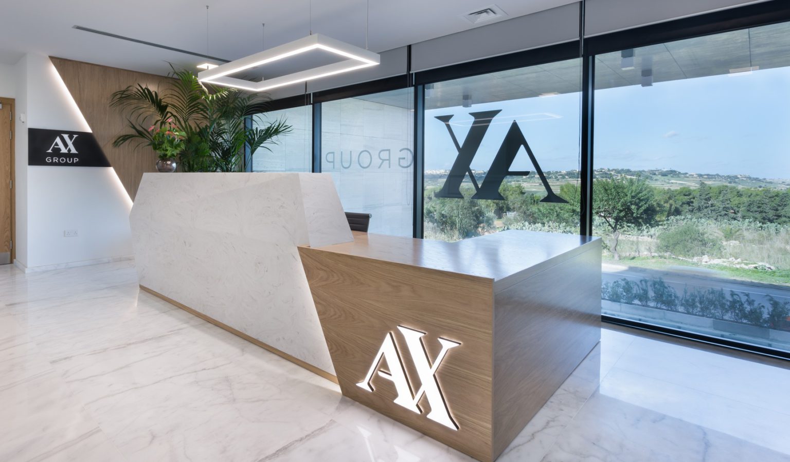 AX Group CEO praises staff for their ‘commitment and determination to ...